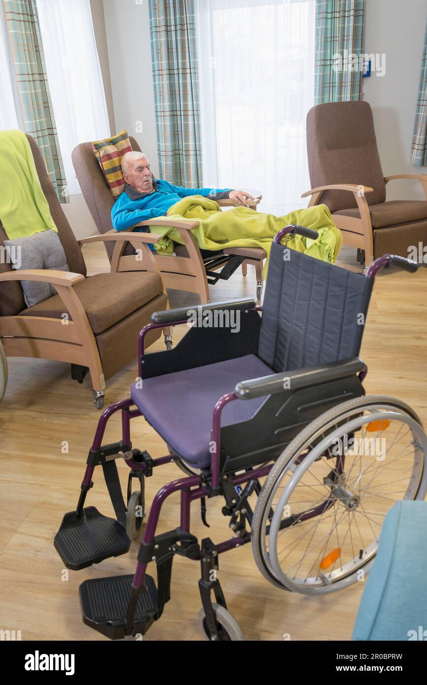 Old man sleeping in armchair hi-res stock photography and images - Alamy