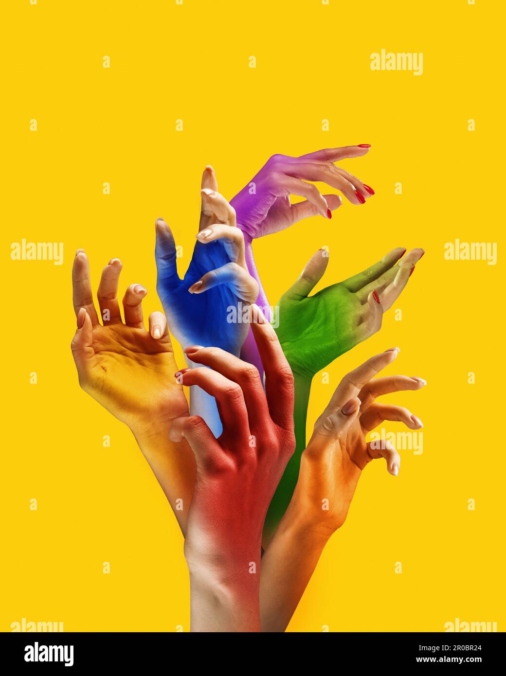 Female hands with rainbow colors over vivid yellow background. Human ...