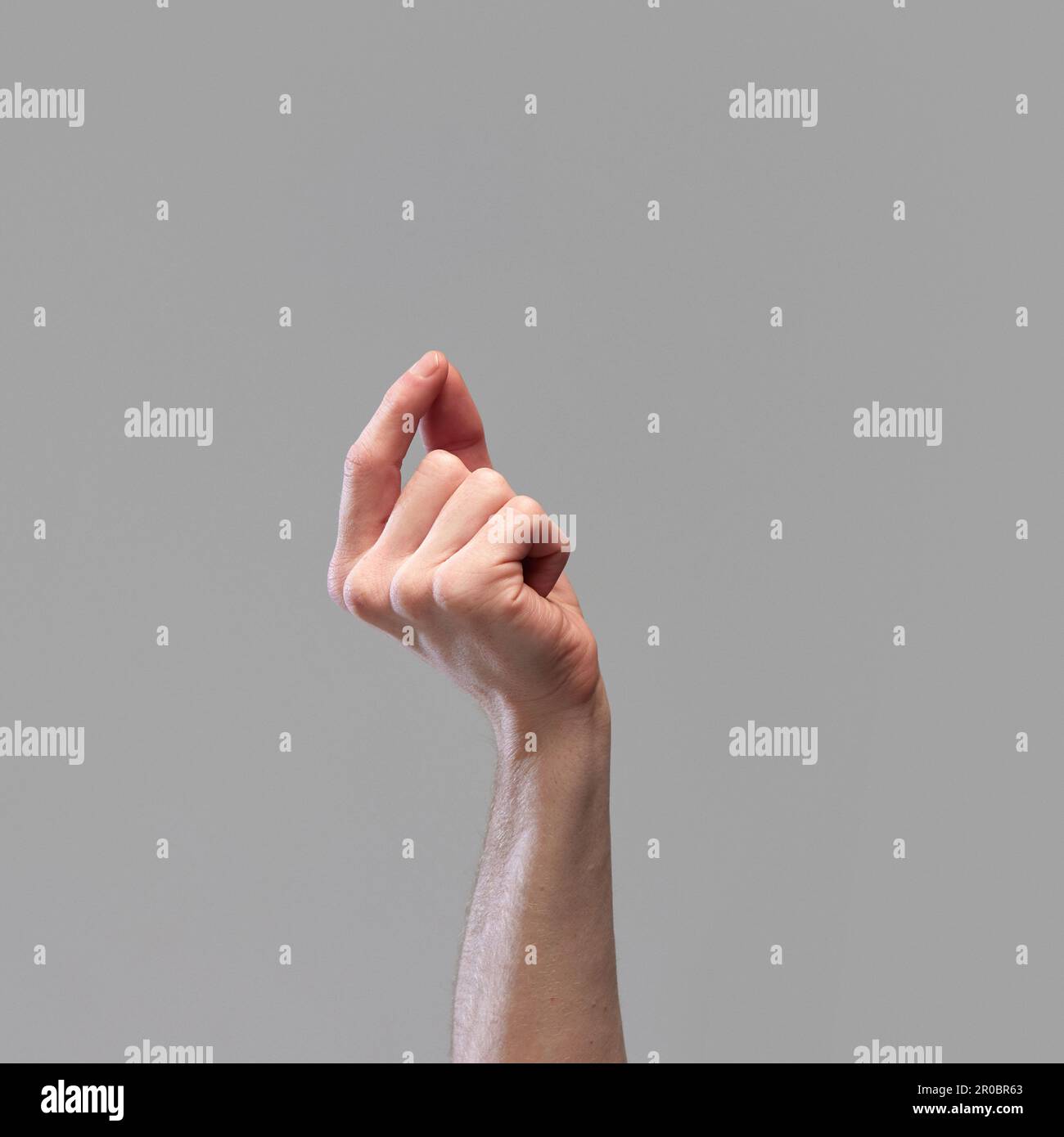 Human hand showing gesture against grey background. Emotional talk ...