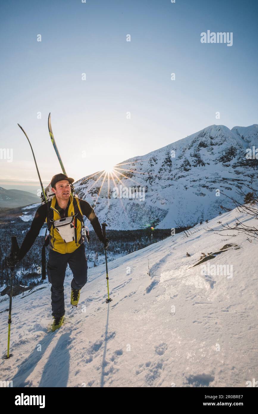 Male mountaineer looks towards summit of Katahdin in winter Stock Photo ...
