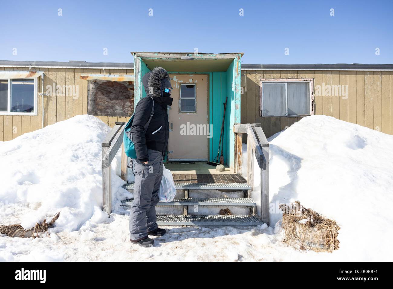 Person standing outside Yukon River Camp Truck Stop Alaksa Stock Photo ...