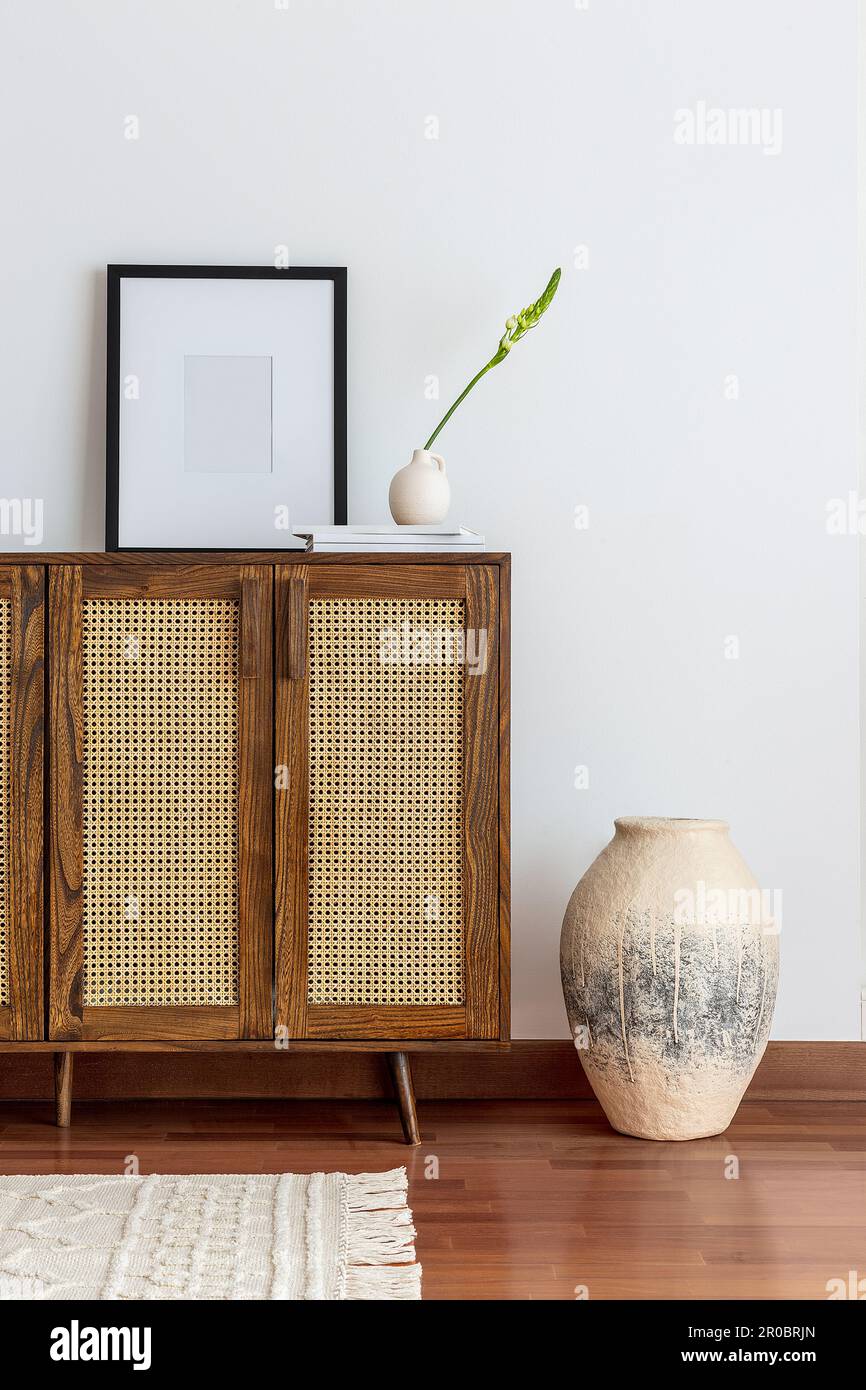 Handmade rattan chest of drawers with papier mache vase Stock Photo - Alamy