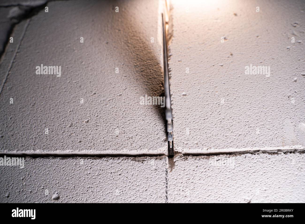 The process of cutting through a wall from an aerated concrete block ...