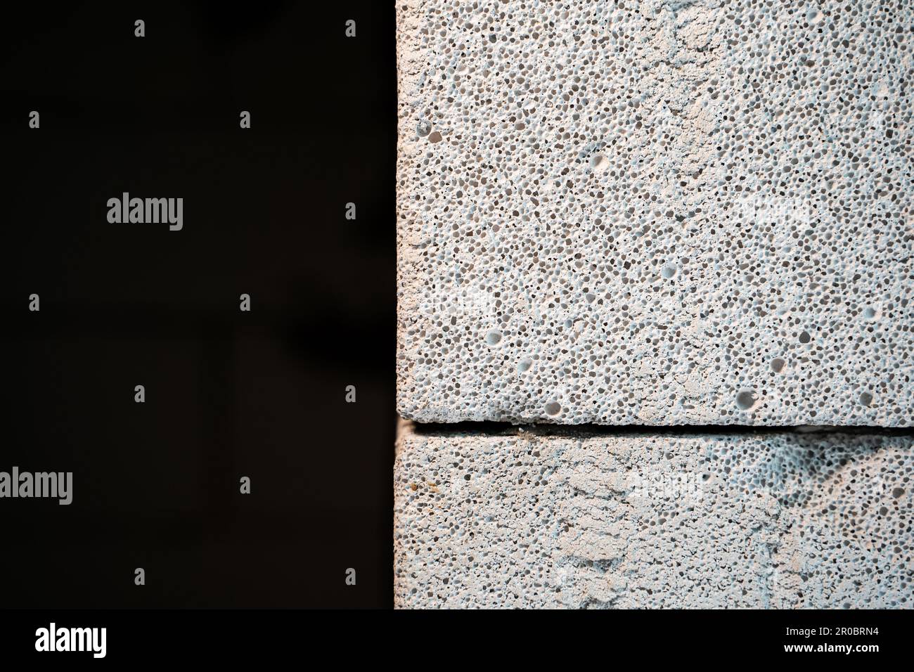 The texture of aerated concrete close-up on a section of an aerated ...