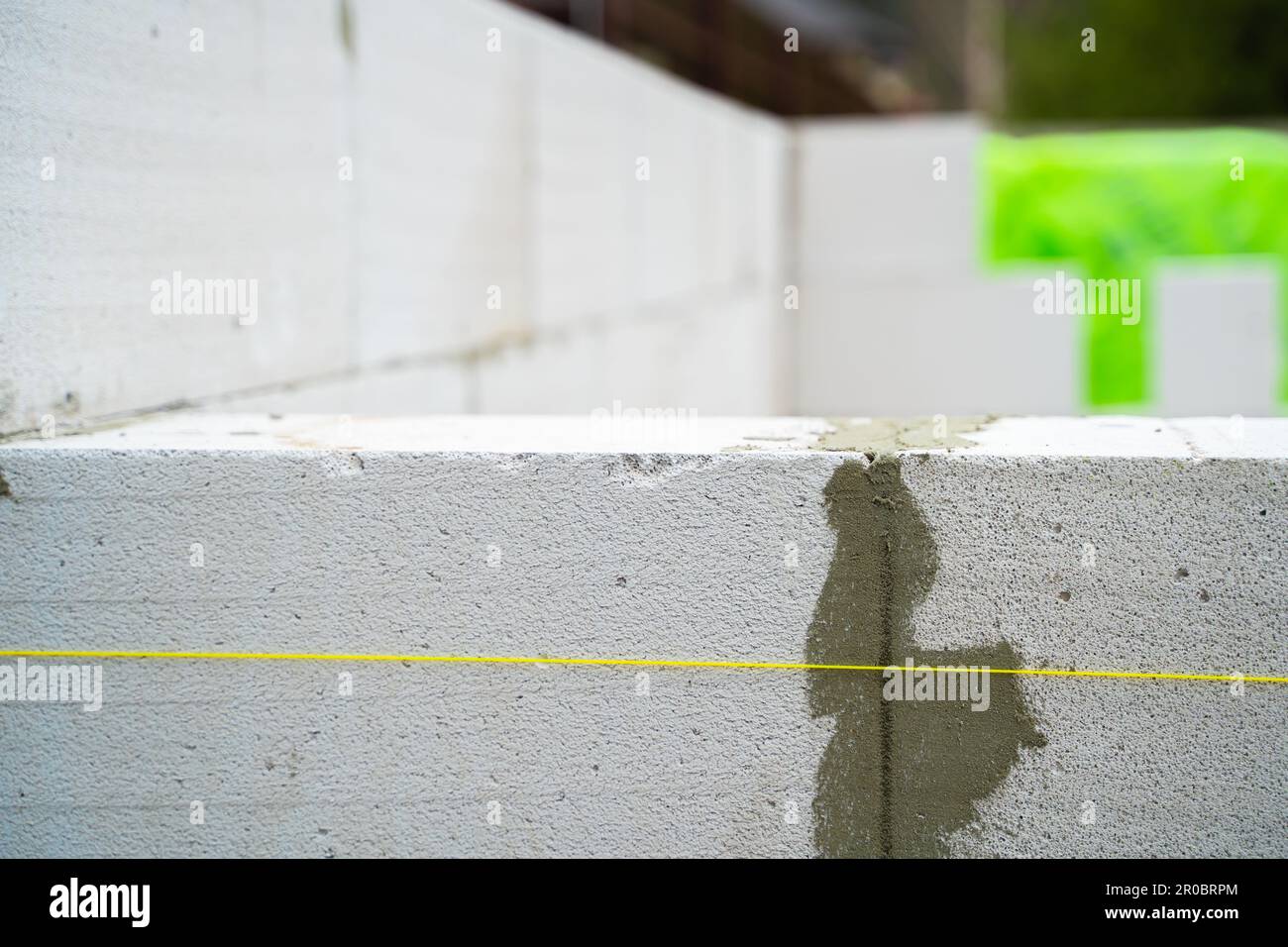 Close-up of a freshly built aerated concrete block wall. High-quality ...