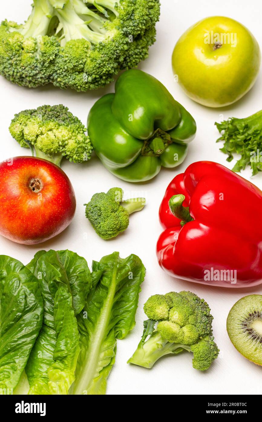 Broccoli and pepper, lettuce, celery stalks, apple, half kiwi and nuts ...
