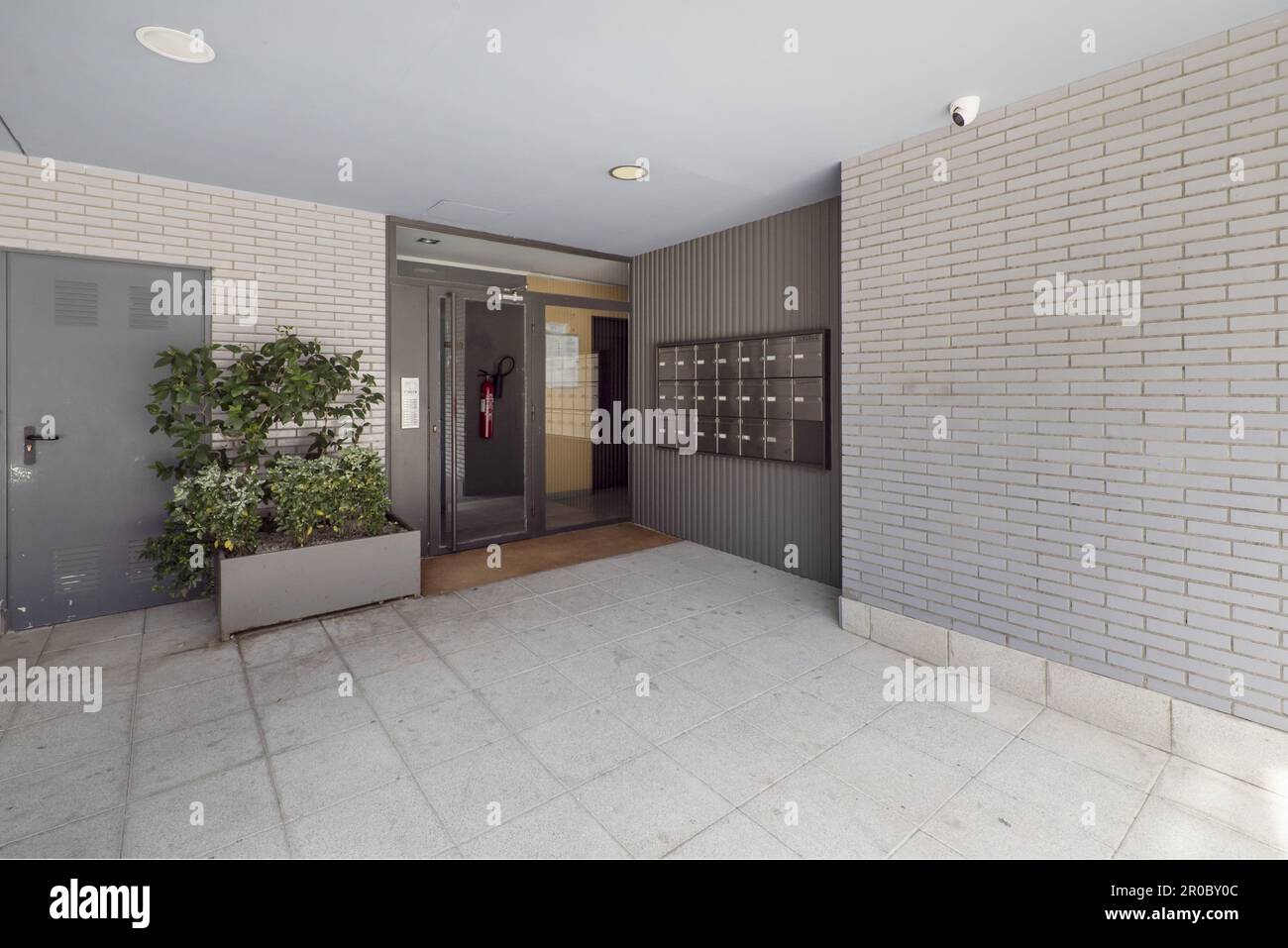 Access door to a residential building with mailboxes for conventional ...