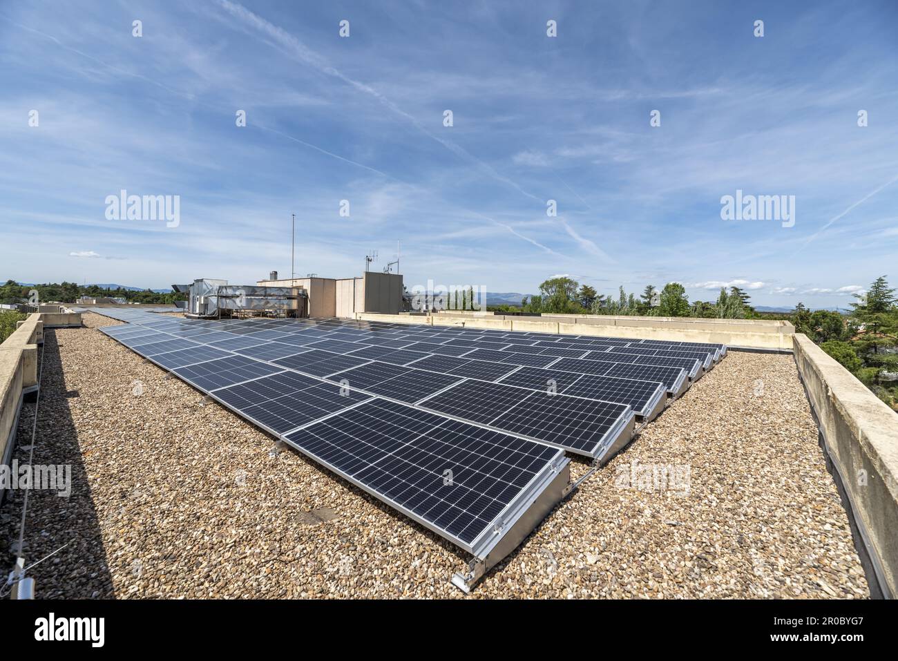 Installation of solar panels on the roof of a building Stock Photo - Alamy