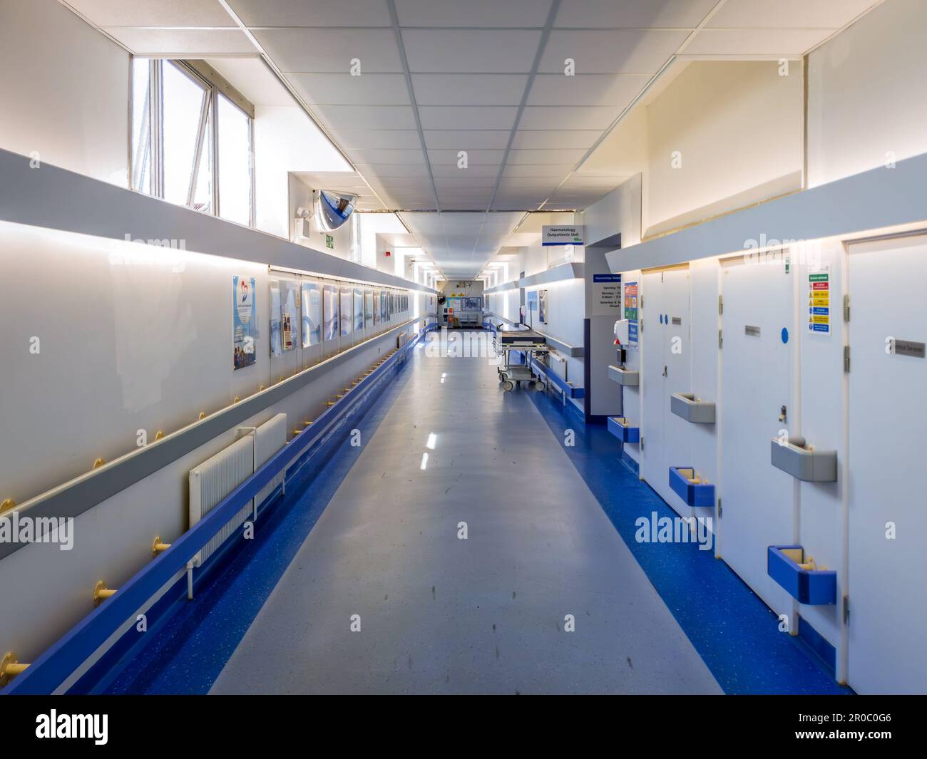 Long empty hospital walkway in england uk Stock Photo - Alamy