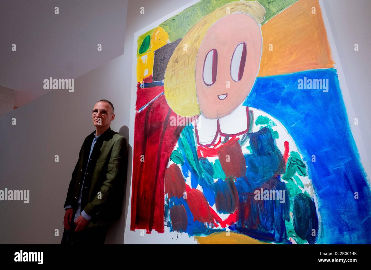 Artist André Butzer poses next to one of his first retrospective ...