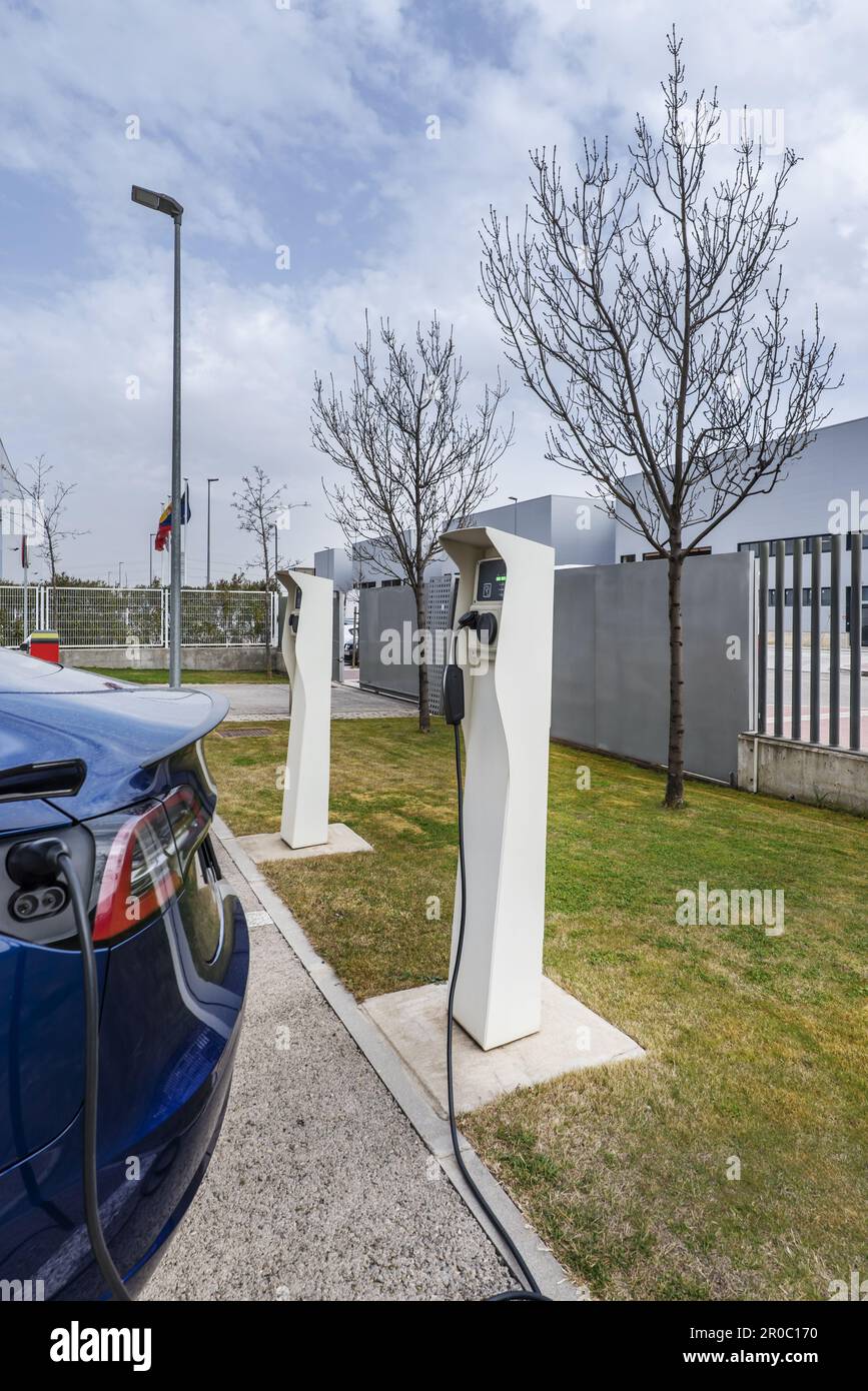 Several fast charging stations for electric vehicles in an open-air car ...