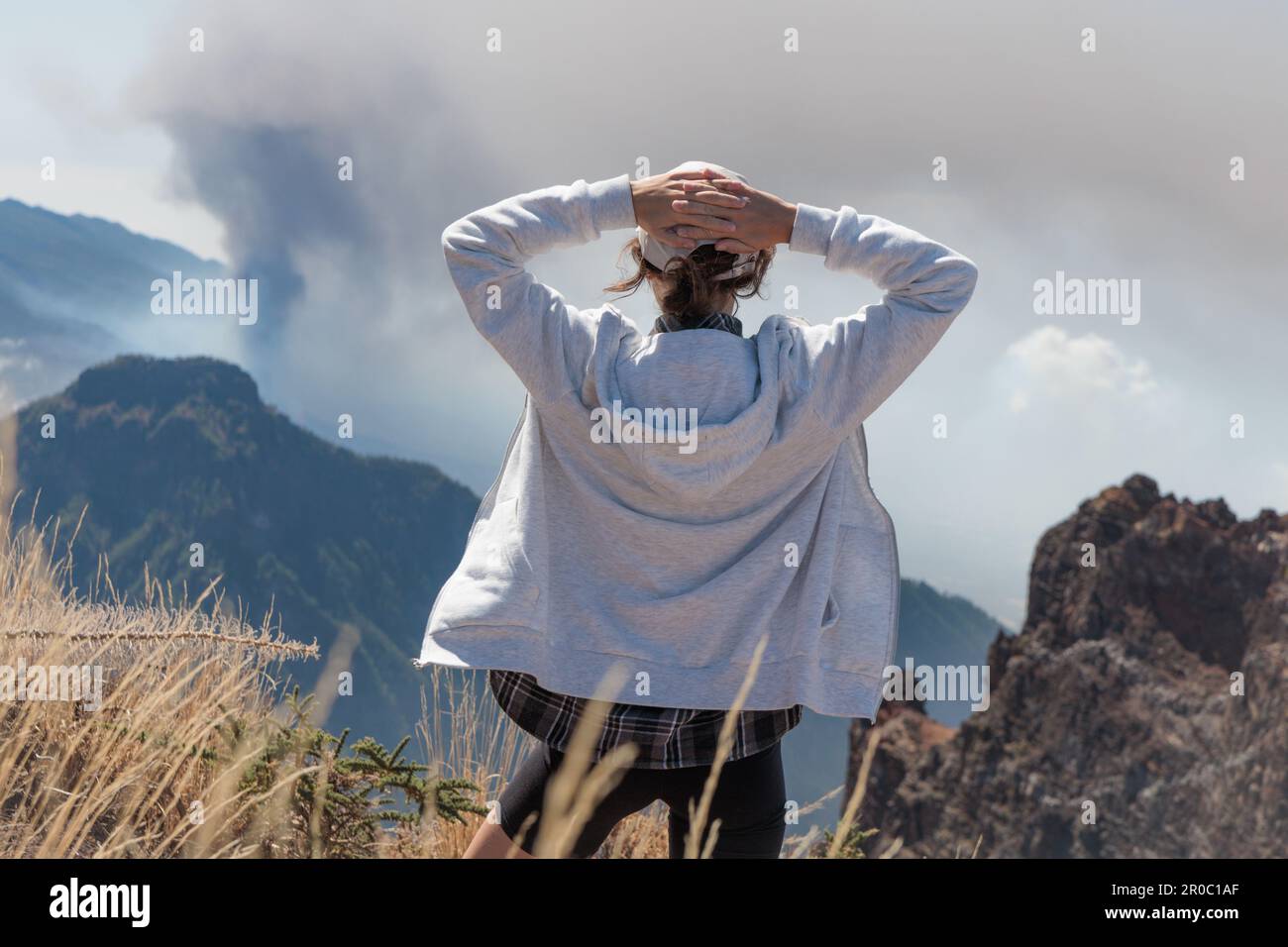 Tourist girl watching Cumbre Vieja volcanic eruption on the island of ...