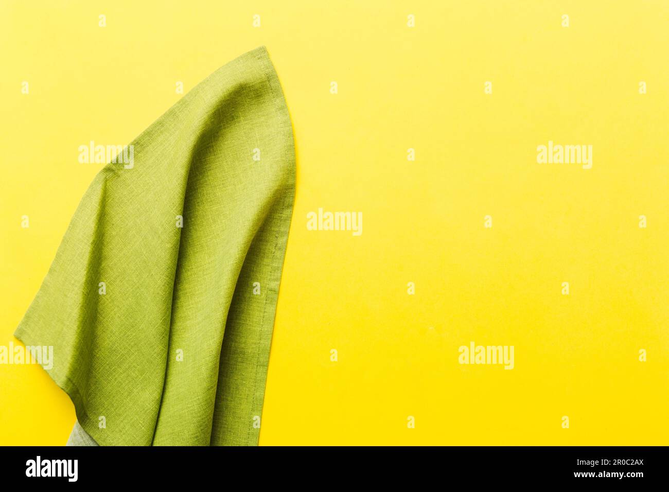 top view with green kitchen napkin isolated on table background. Folded ...