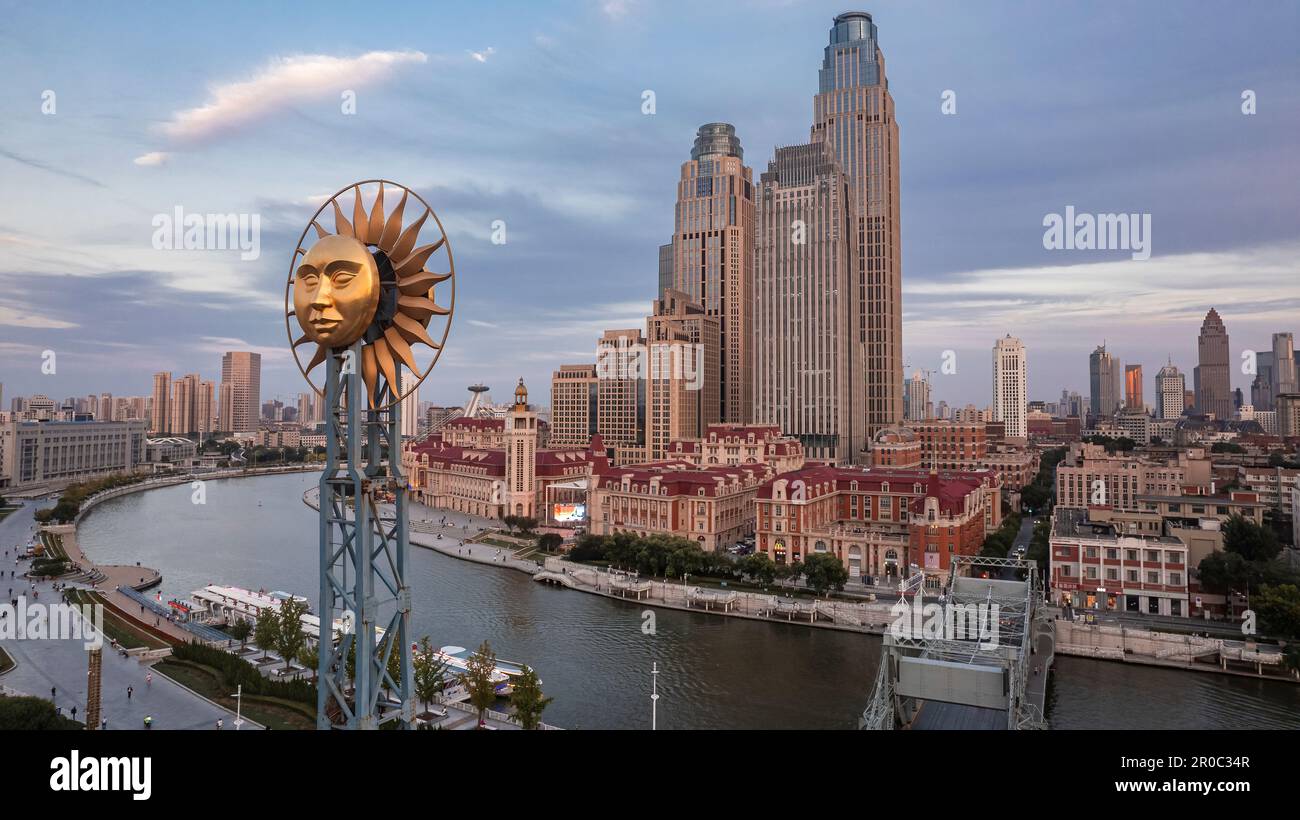 A stunning aerial view of a bustling metropolis by the Haihe River snaking through the cityscape ...