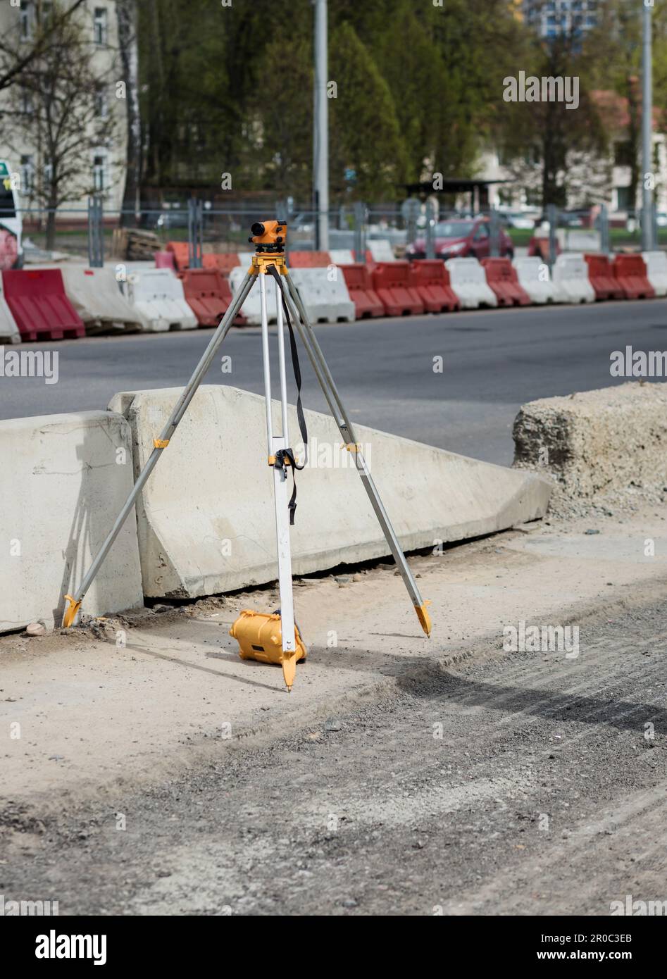 Surveyor engineer with equipment on the construction road. theodolite ...