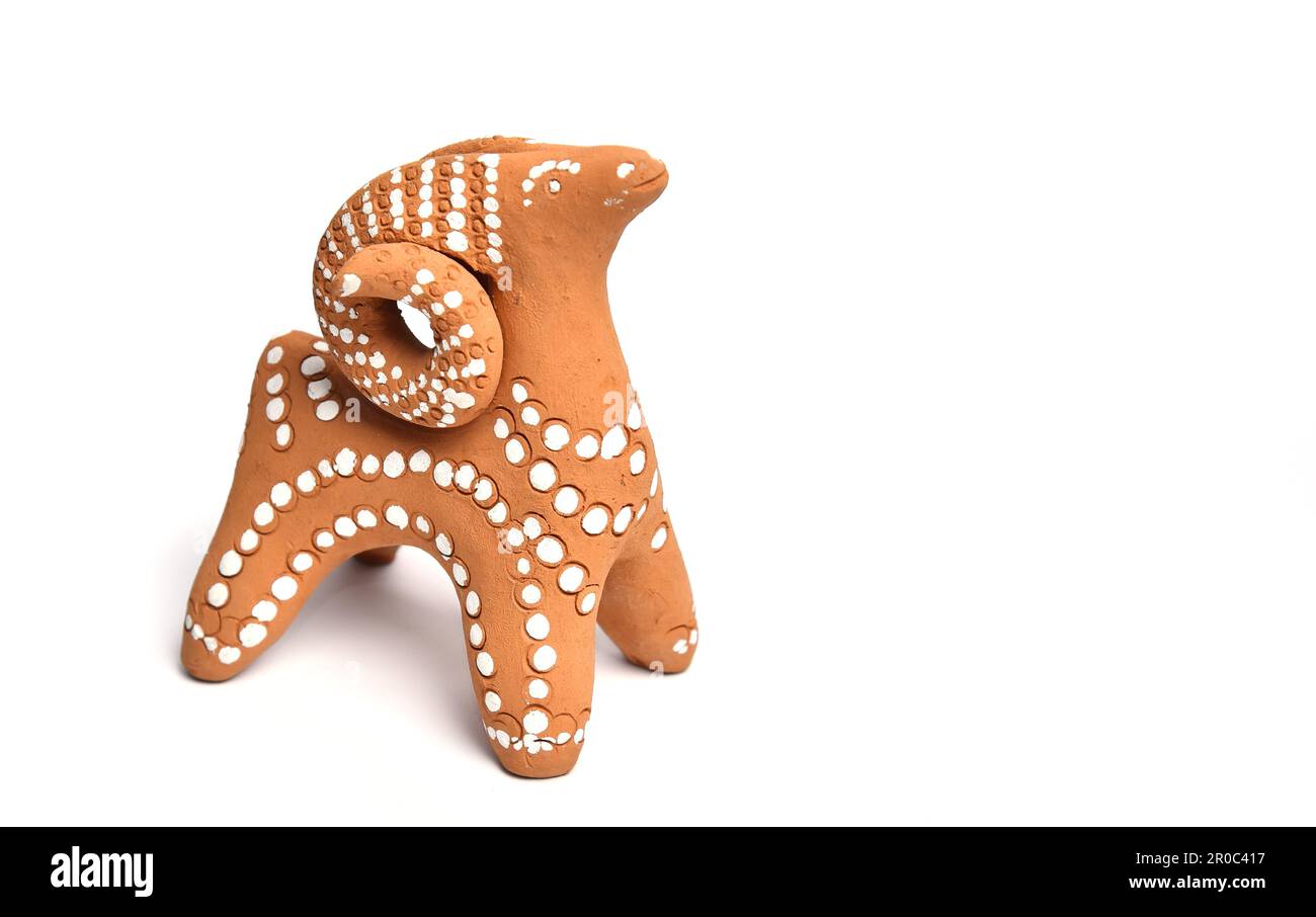 Clay toy souvenir ram on a white background. Ethno clay product ...