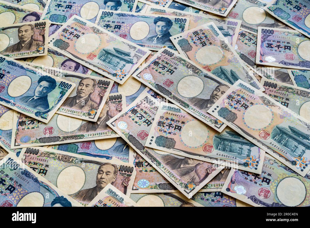 Japanese currency. View looking down at a pile of Japanese banknotes in ...