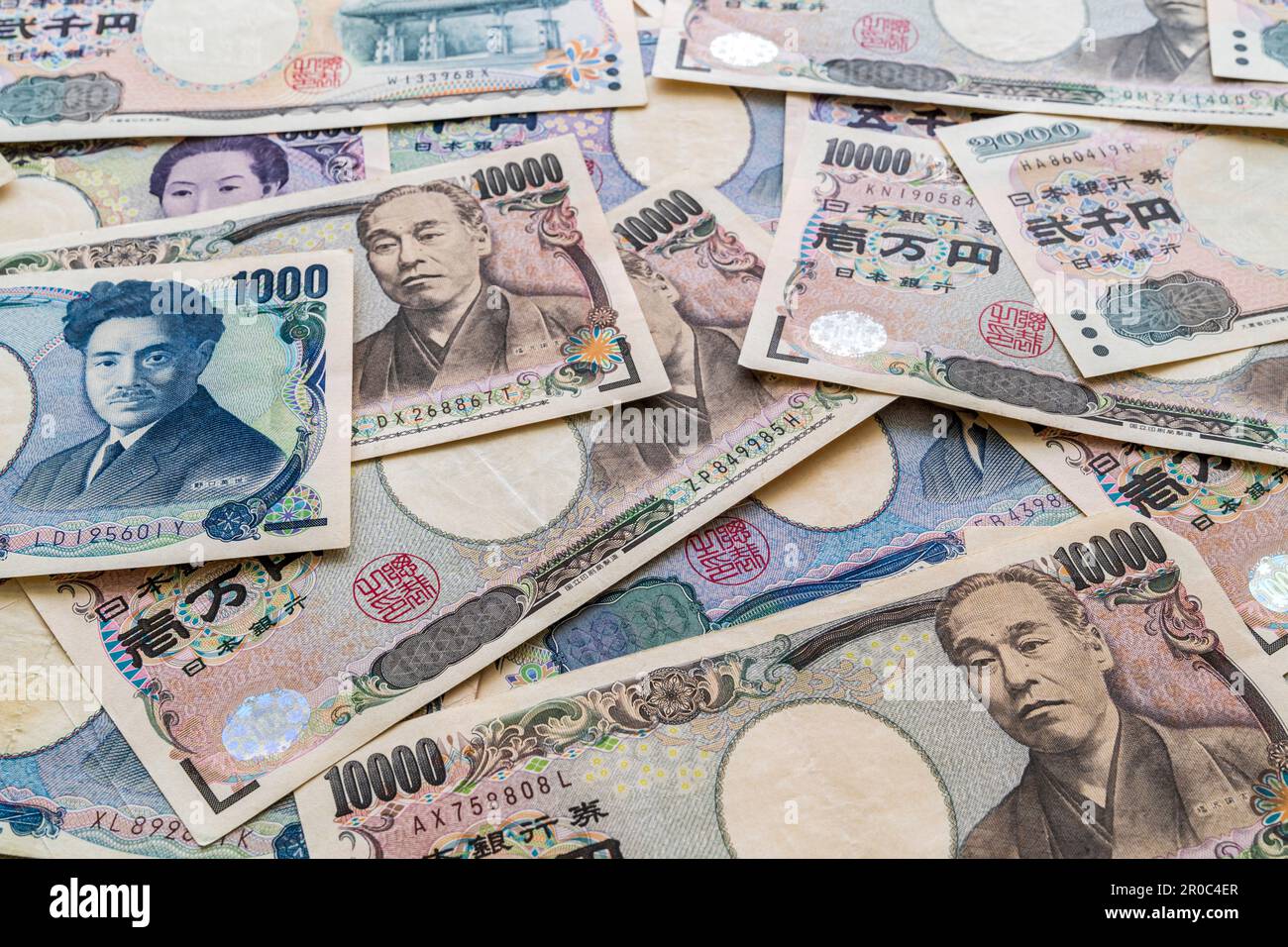 Japanese currency. View looking down at a pile of Japanese banknotes in ...