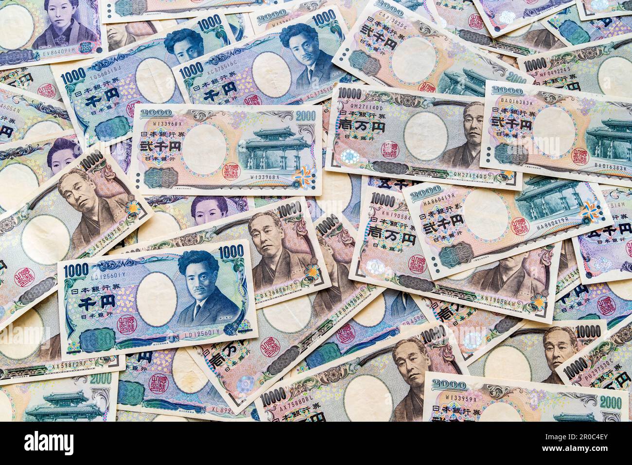 Japanese currency. View looking down at a pile of Japanese banknotes in ...