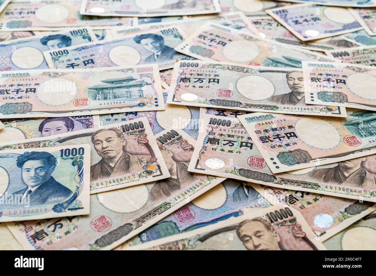 Japanese currency. View looking down at a pile of Japanese banknotes in ...