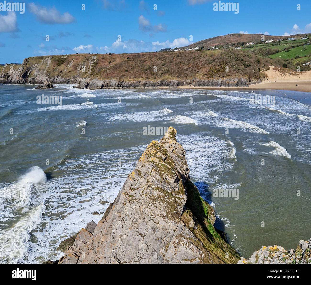The three cliffs are visible in the background, with their sharp angles ...