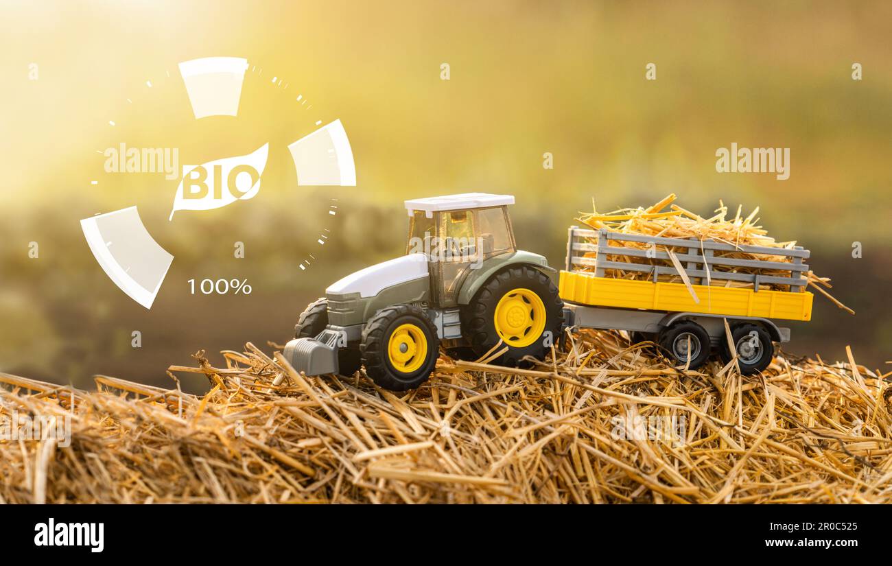 Toy agricultural tractor with BIO symbol. Biofuel concept Stock Photo ...