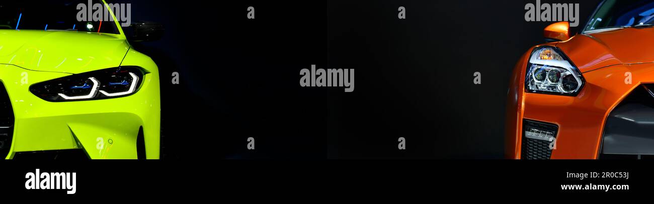 green and orange LED headlights sports car on black background free ...