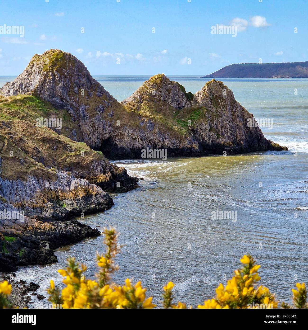 The three cliffs are visible in the background, with their sharp angles ...