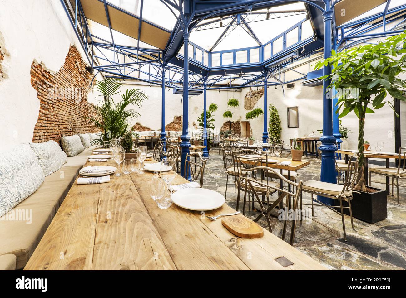 Nice hall of a restaurant with an old metal structure that holds some ...