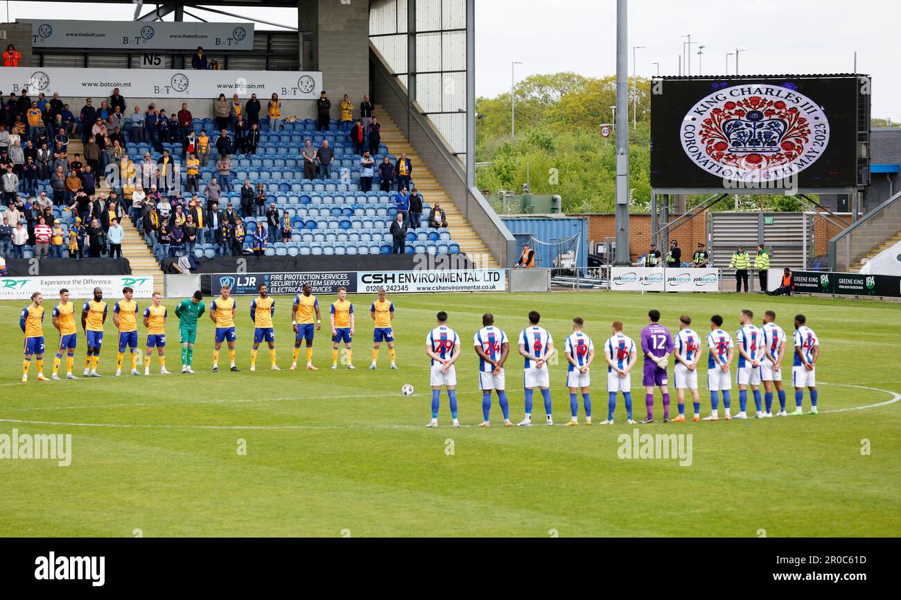 The players stand for the national anthem to commemorate the coronation ...