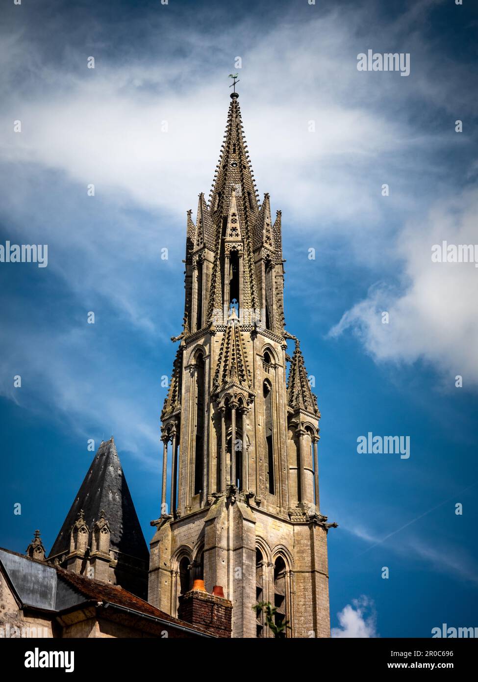 A vertical shot of Bristol High Cross under a blue cloudy sky in ...