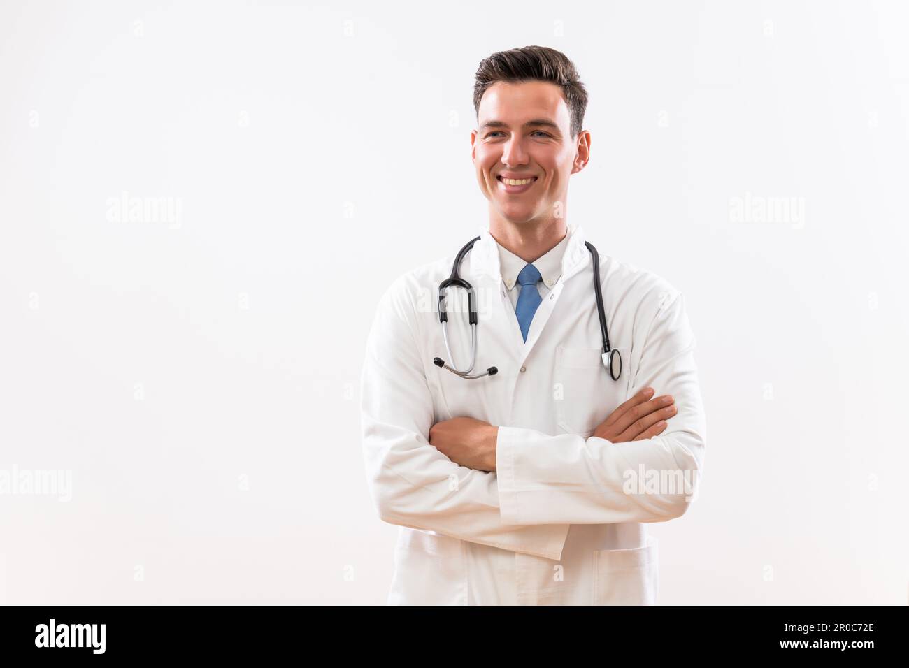 Portrait of young successful doctor thinking Stock Photo - Alamy