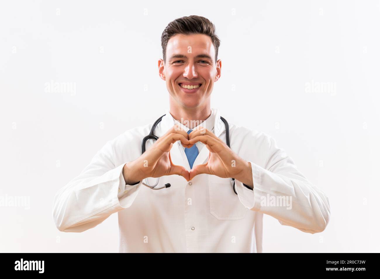 Portrait of doctor showing heart shape with hands Stock Photo - Alamy