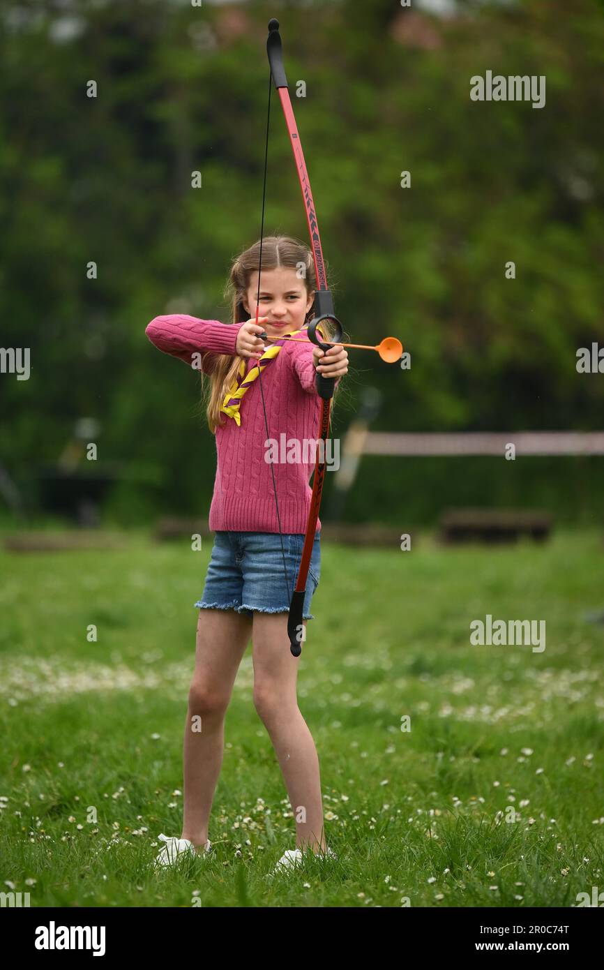 Princess Charlotte tries archery while joining volunteers to help ...