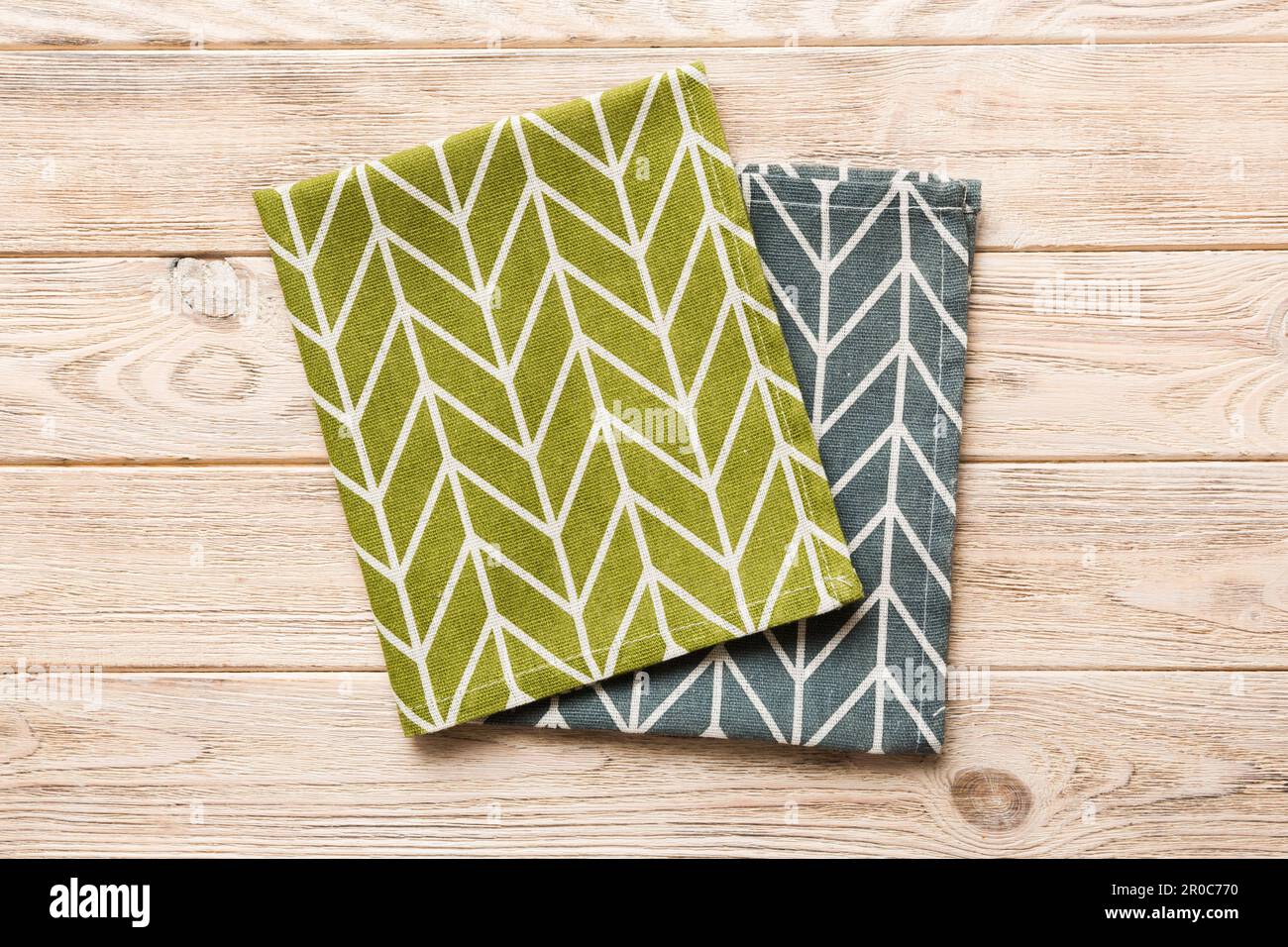 top view with green kitchen napkin isolated on table background. Folded ...