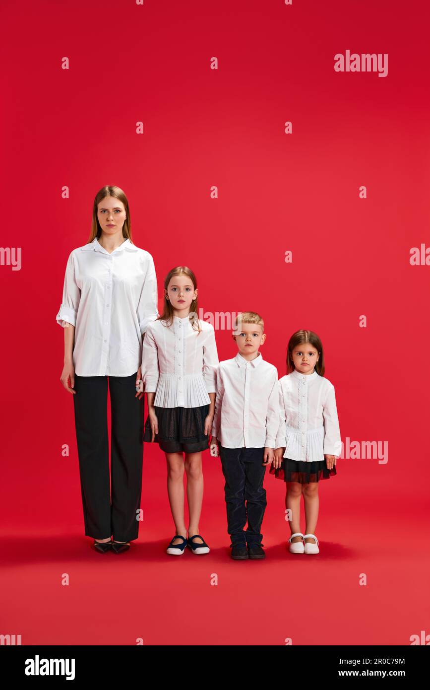 Portrait of beautiful woman and cute little children, boy and girls ...