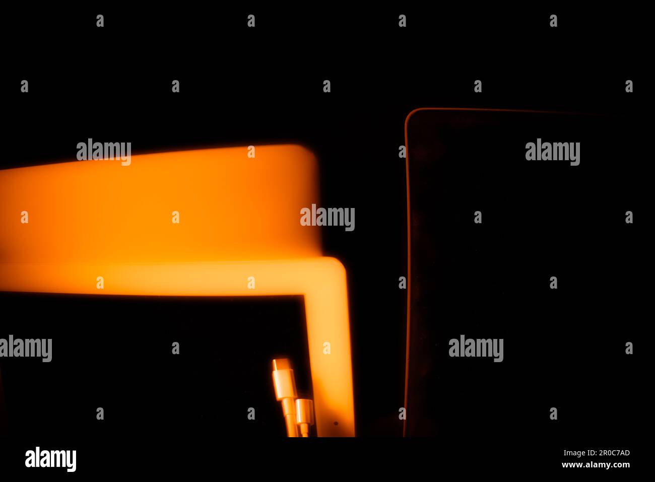 Diffuse Patterns view of laptop,Tablet of workspace in dark background ...