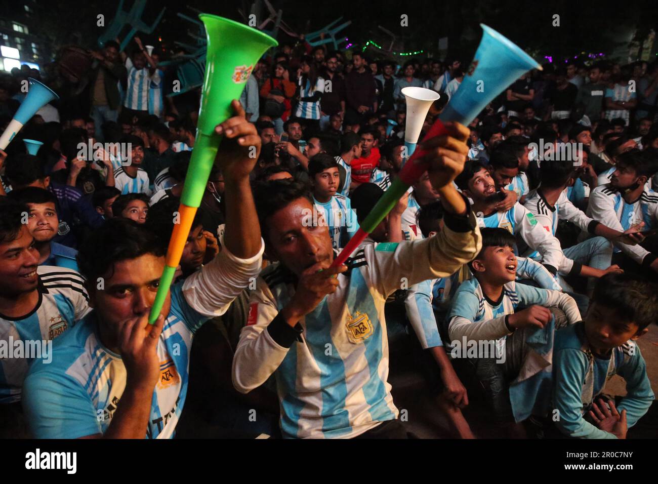 Crazy Argentina football fans of Bangladesh watching Argentina and Poland match at Dhaka ...