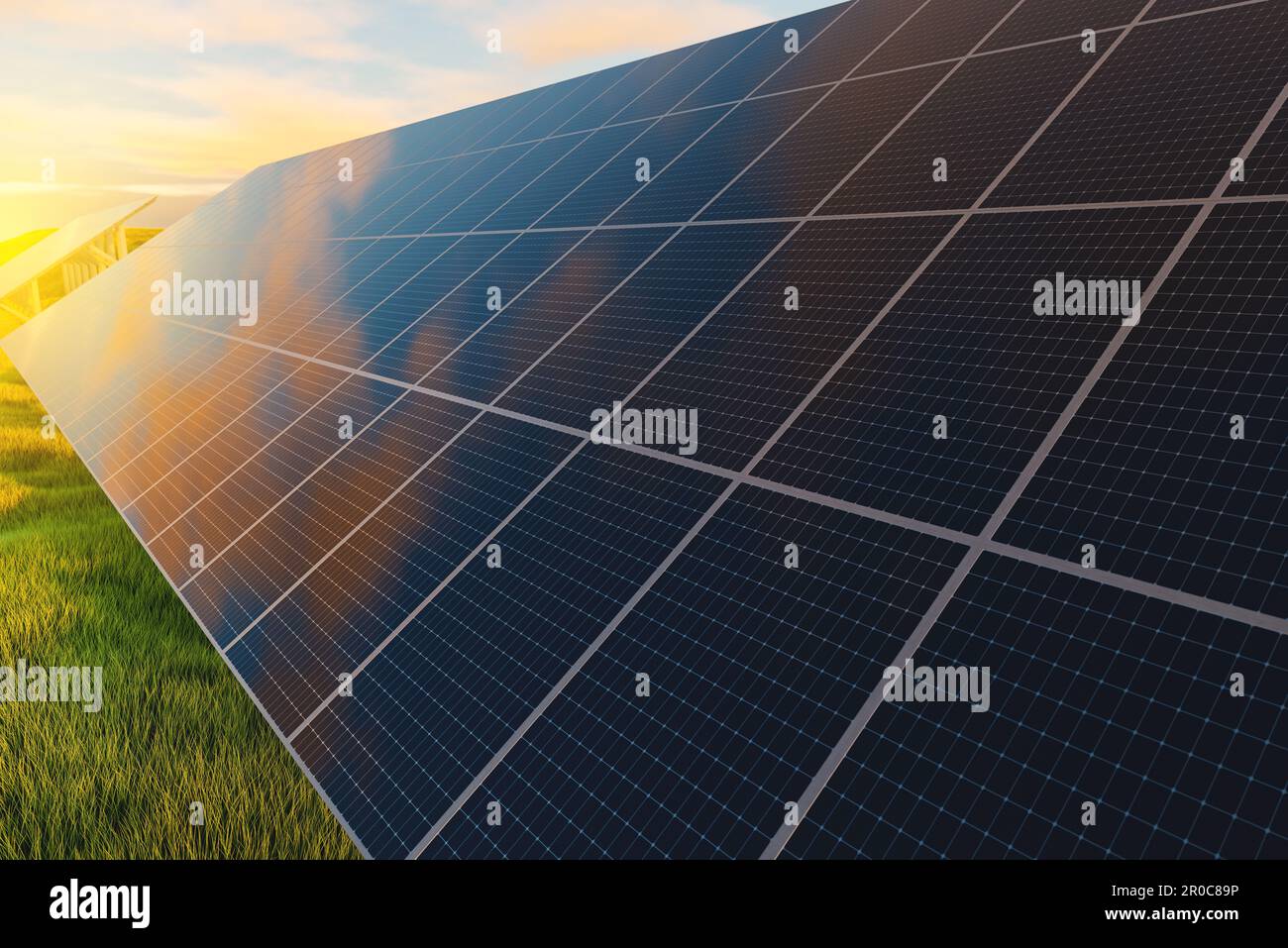 Solar panels at sunset in a field against the backdrop of green grass ...