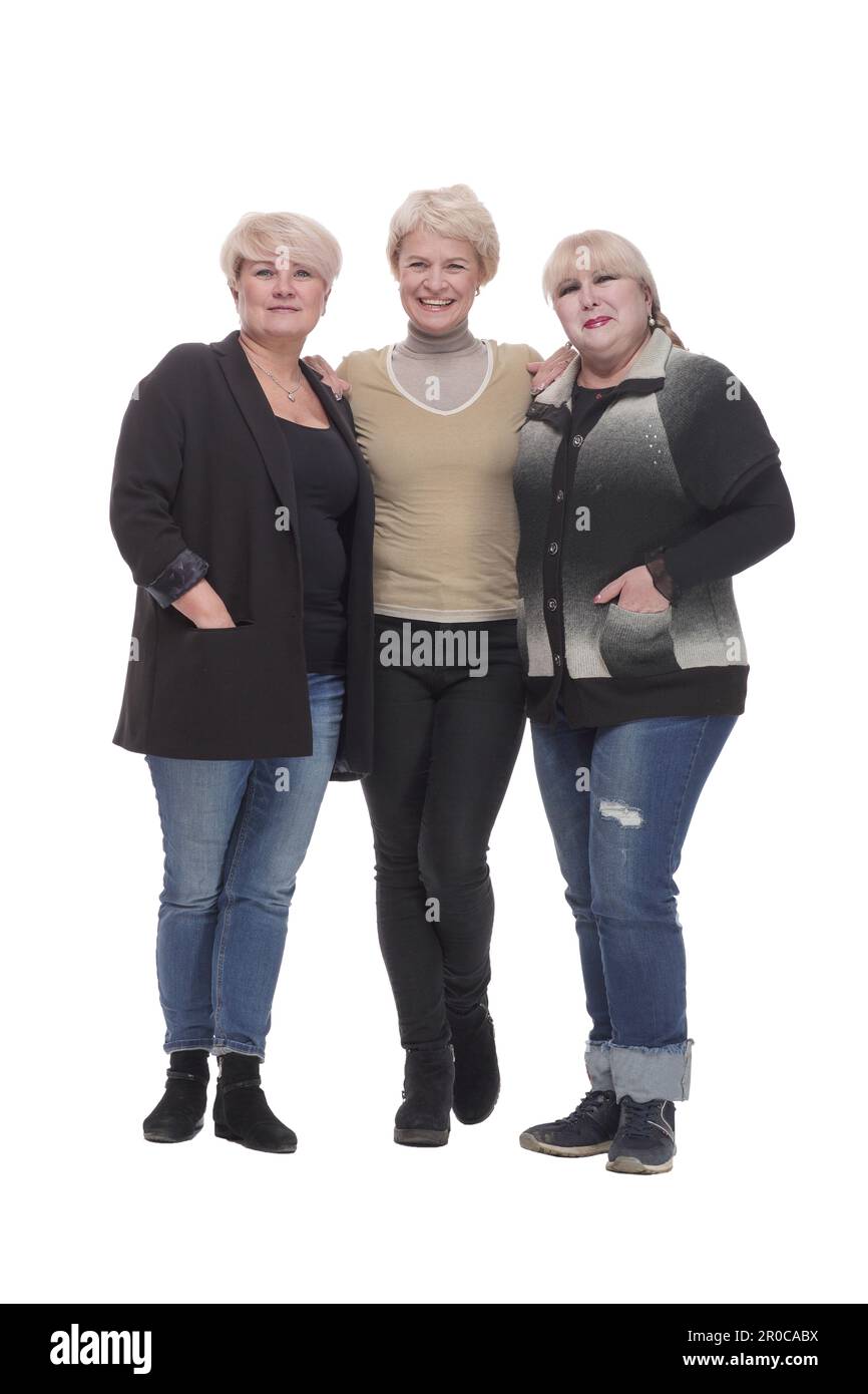 in full growth. three happy women standing together Stock Photo - Alamy