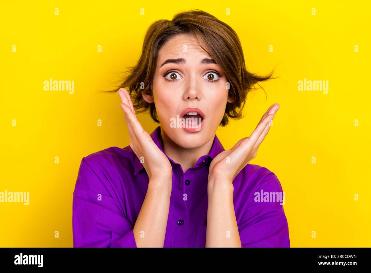 Portrait of young surprised amazed woman touch cheeks terrified scared ...