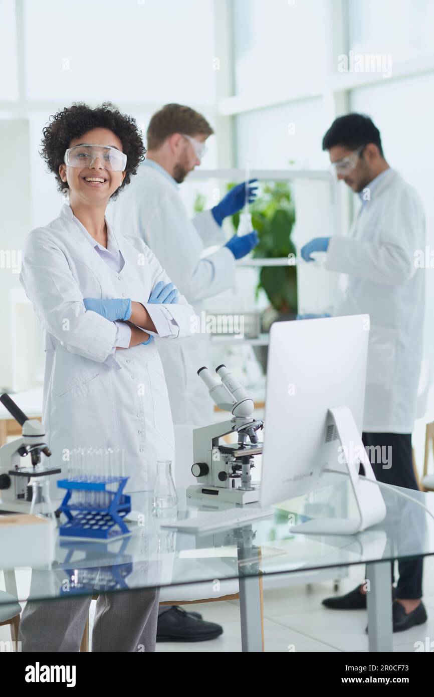 Smiling scientists looking at camera arms crossed in laboratory Stock ...