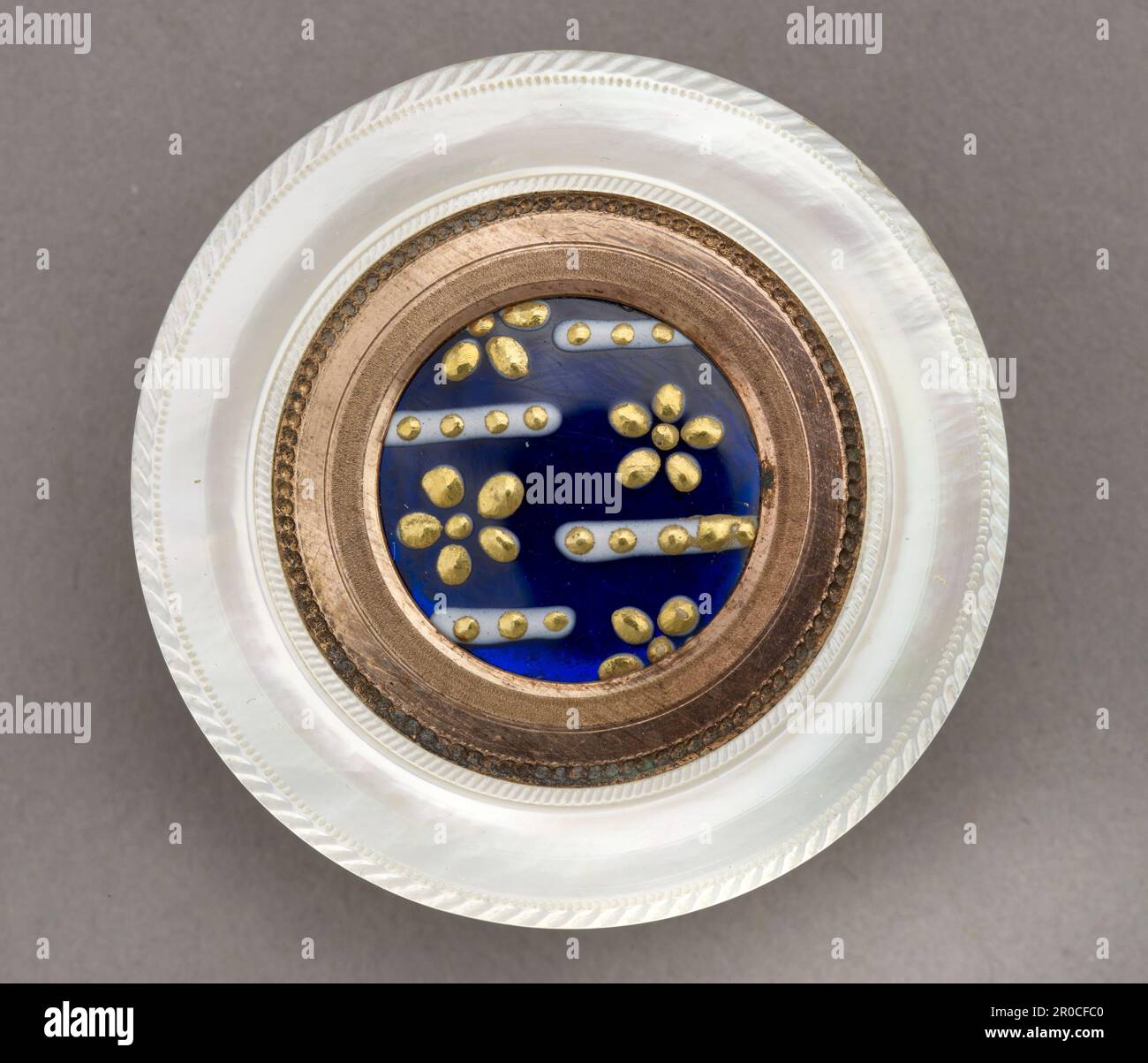 Pearl button, 1770-1800.. Lightly carved with concentric designs and ...