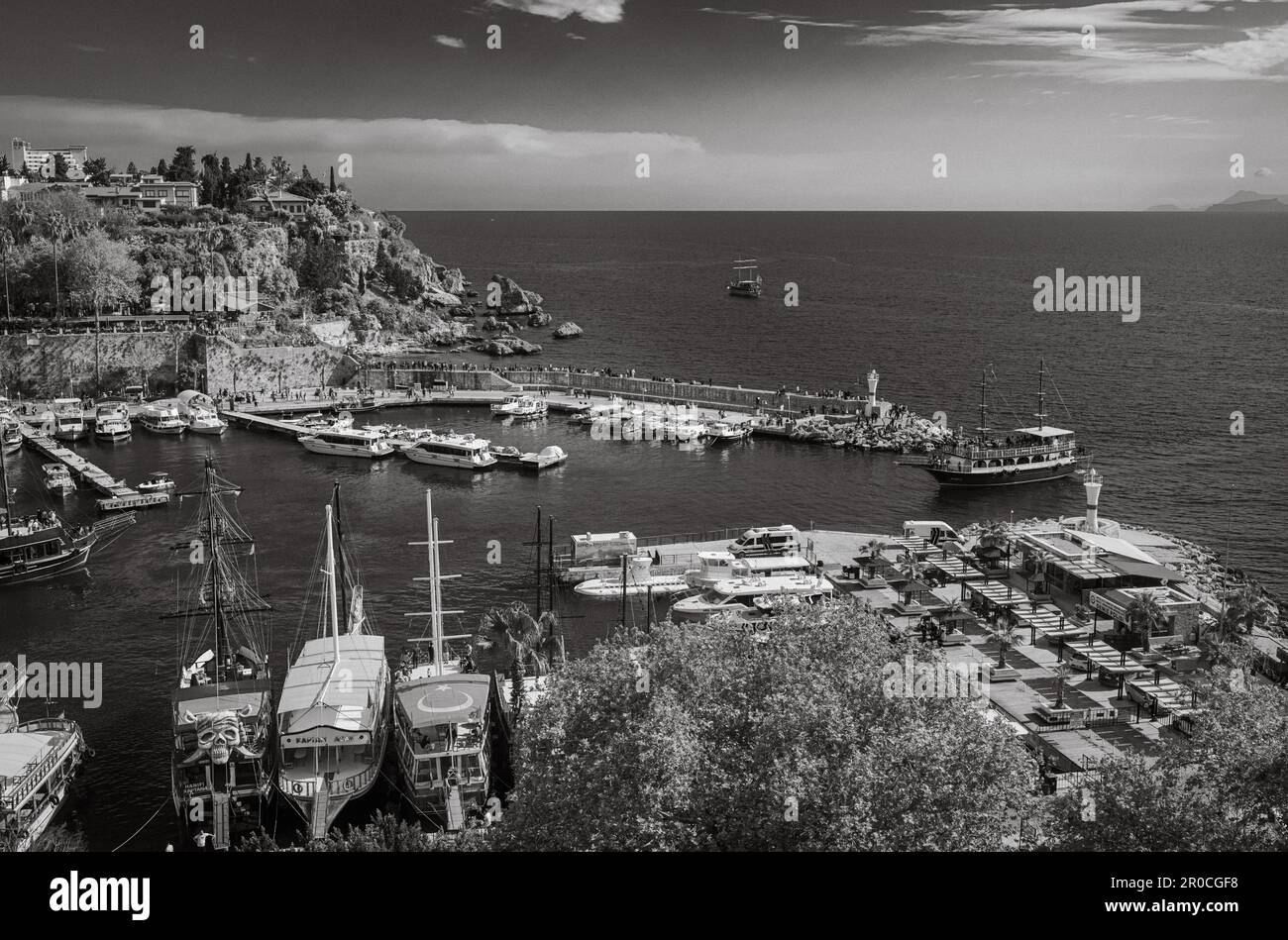 A tourist boat sails gracefully through the entrance of the ancient ...