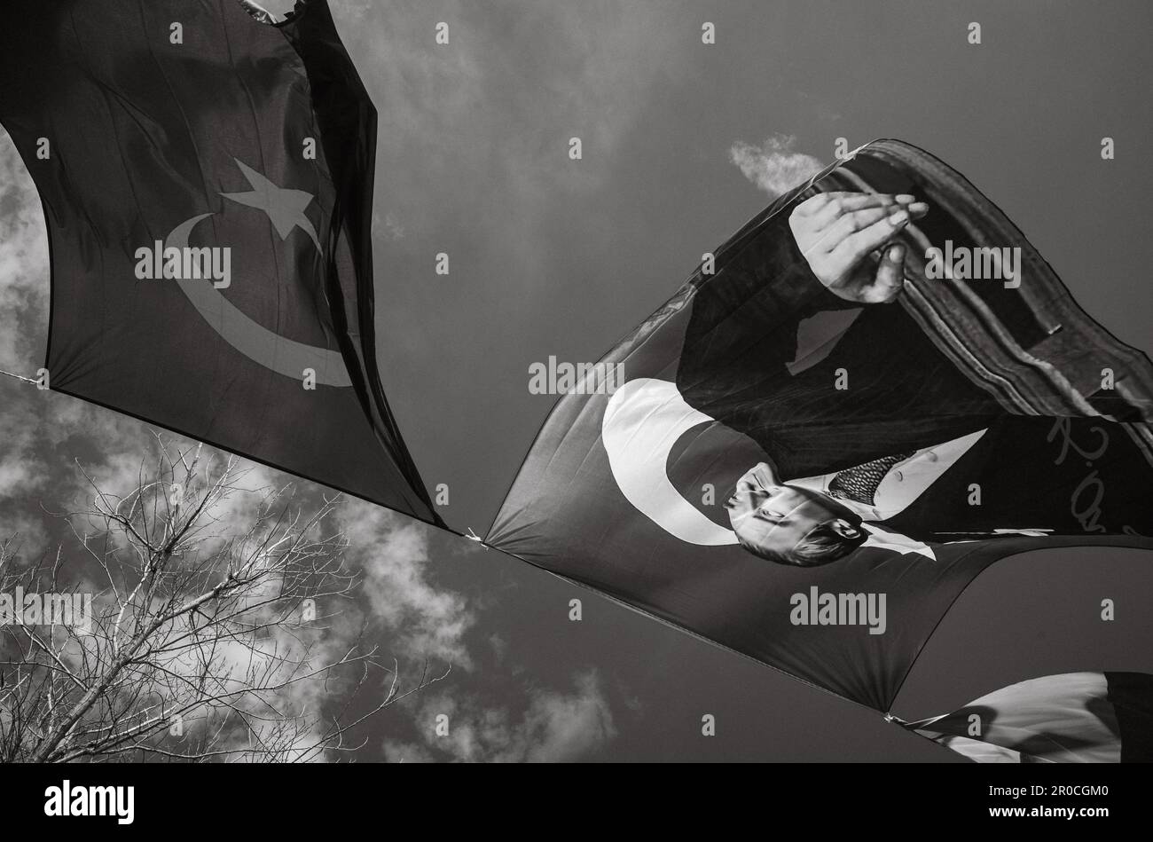The display of banners and flags flying high in the wind on a rope ...