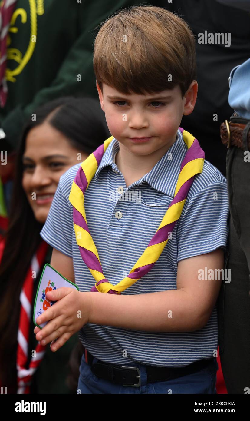 Prince Louis receives a Scouts badge and scarf, also known as a necker ...