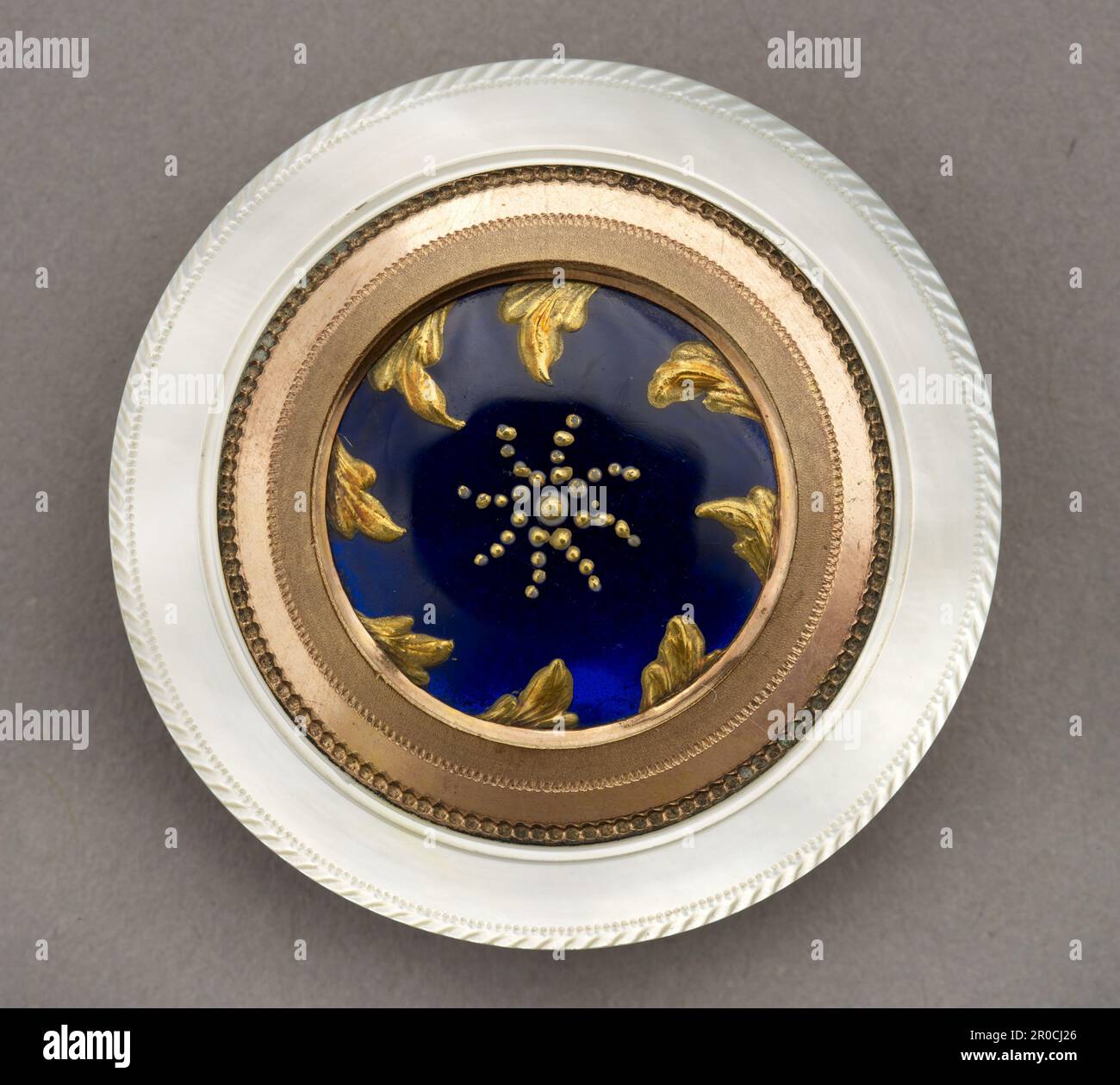 Pearl button rim engraved with rope-like design, 1770-1800.. A gilt ...