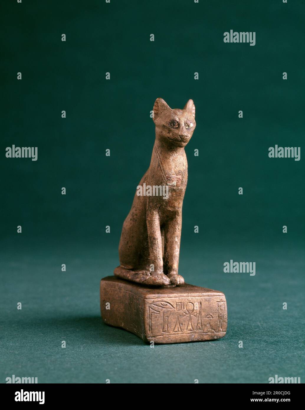 Cat Figurine. Seated bronze cat, wearing copper pectoral with Wedjat ...