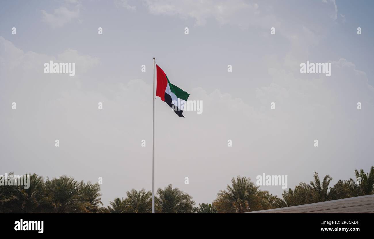 United Arab Emirates flag flying against sky. UAE celebrates it's ...