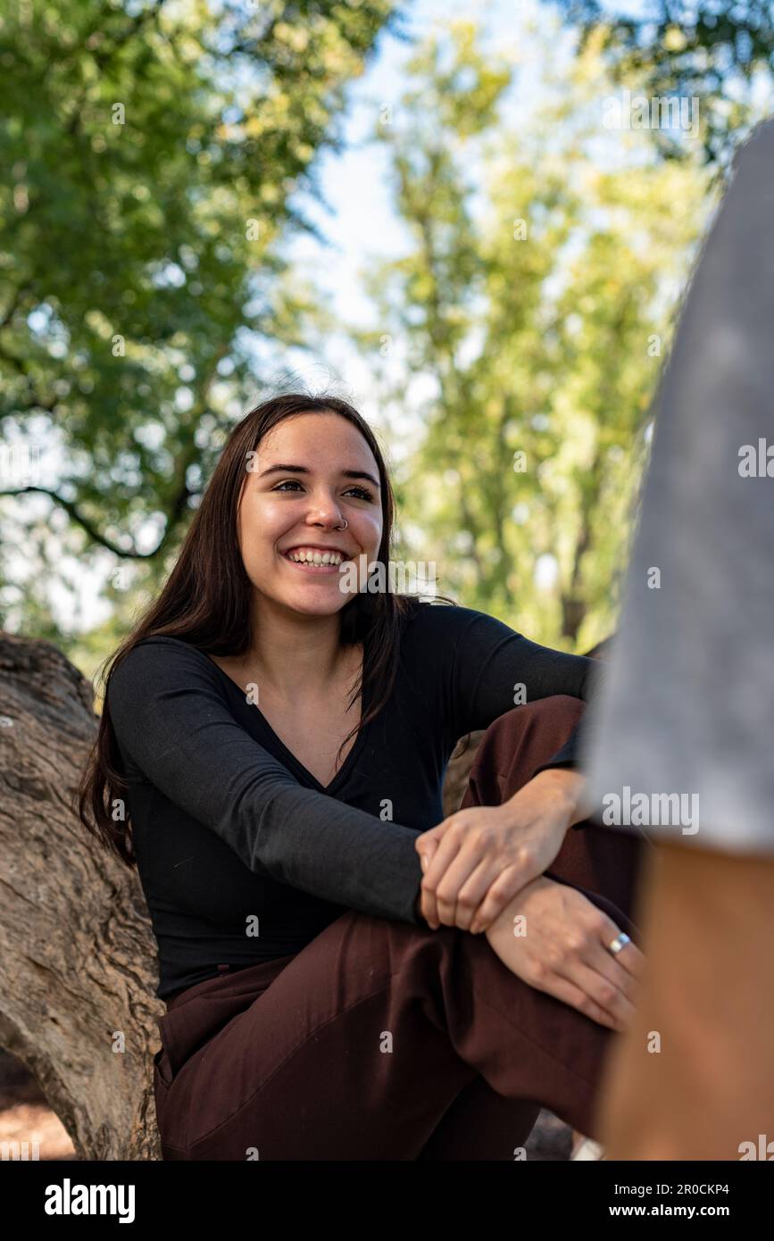 Young man takes the hand of a beautiful girl asking her to go with him ...